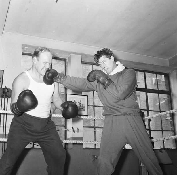 Roger Moore ''The Saint' and Nosher Powell, sparring together, in ...