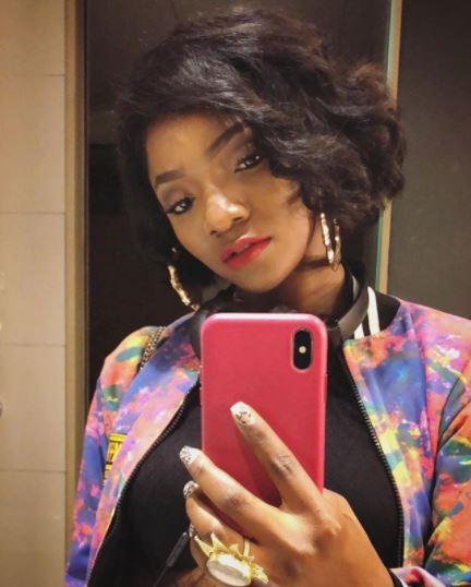 Simi unveils album cover for upcoming album 'Omo Charlie Champagne ...