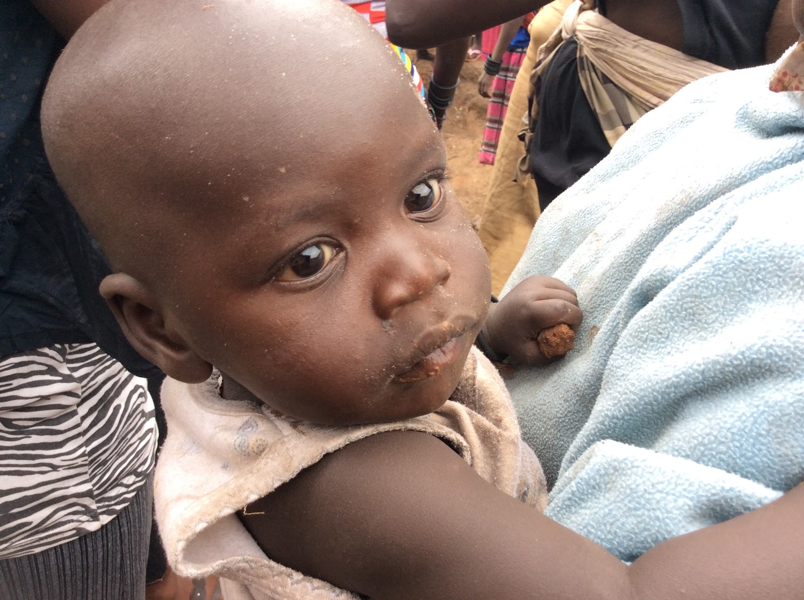 Follow Me to Africa: Baby eating mud cookie