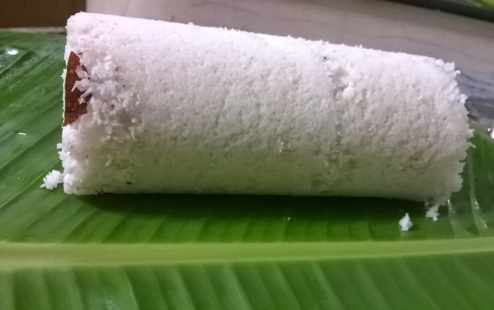PUTTU (Rice Powder steamed with layers of grated coconut in cylindrical ...