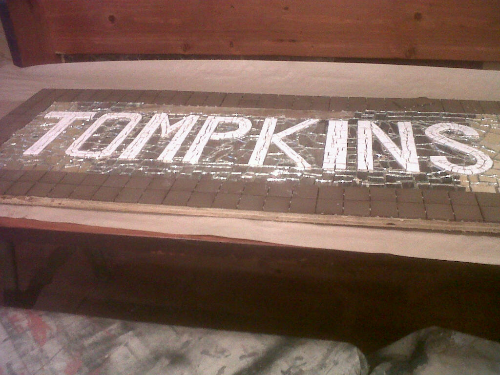 EV Grieve: The Mosaic Man is working on the Tompkins Square Bagels sign