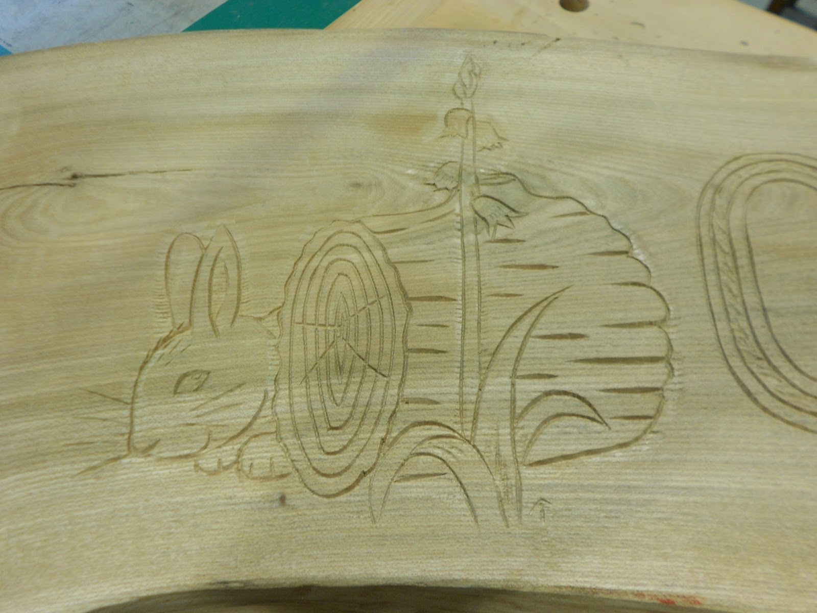 Carving a rabbit onto a wooden bench | Carvings with Stories: a blog ...