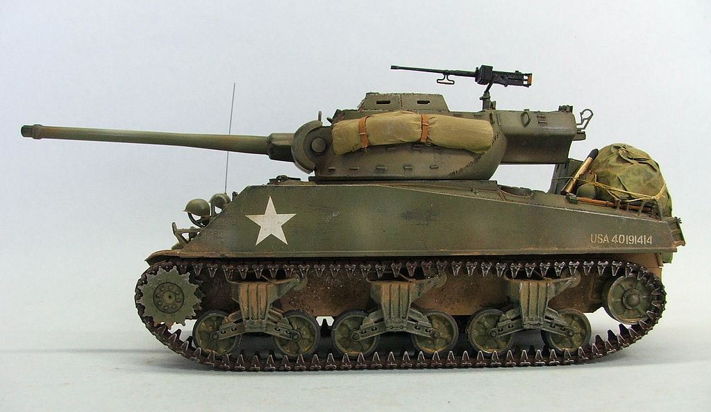 US tank destroyer M36 fires its 90mm gun point-blank at a Nazi pillbox ...