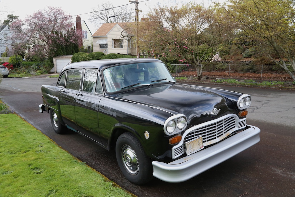 OLD PARKED CARS.: 1975 Checker Marathon.