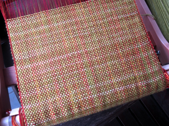Weaving, in green and orange