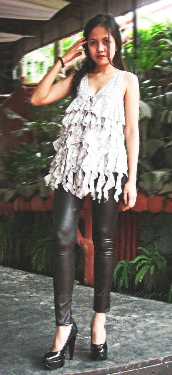 Ripped and raffled blouse.