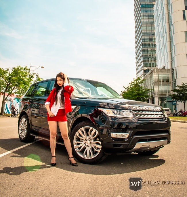 Rebellion office girl poses with Range Rover Sport | Carsfresh