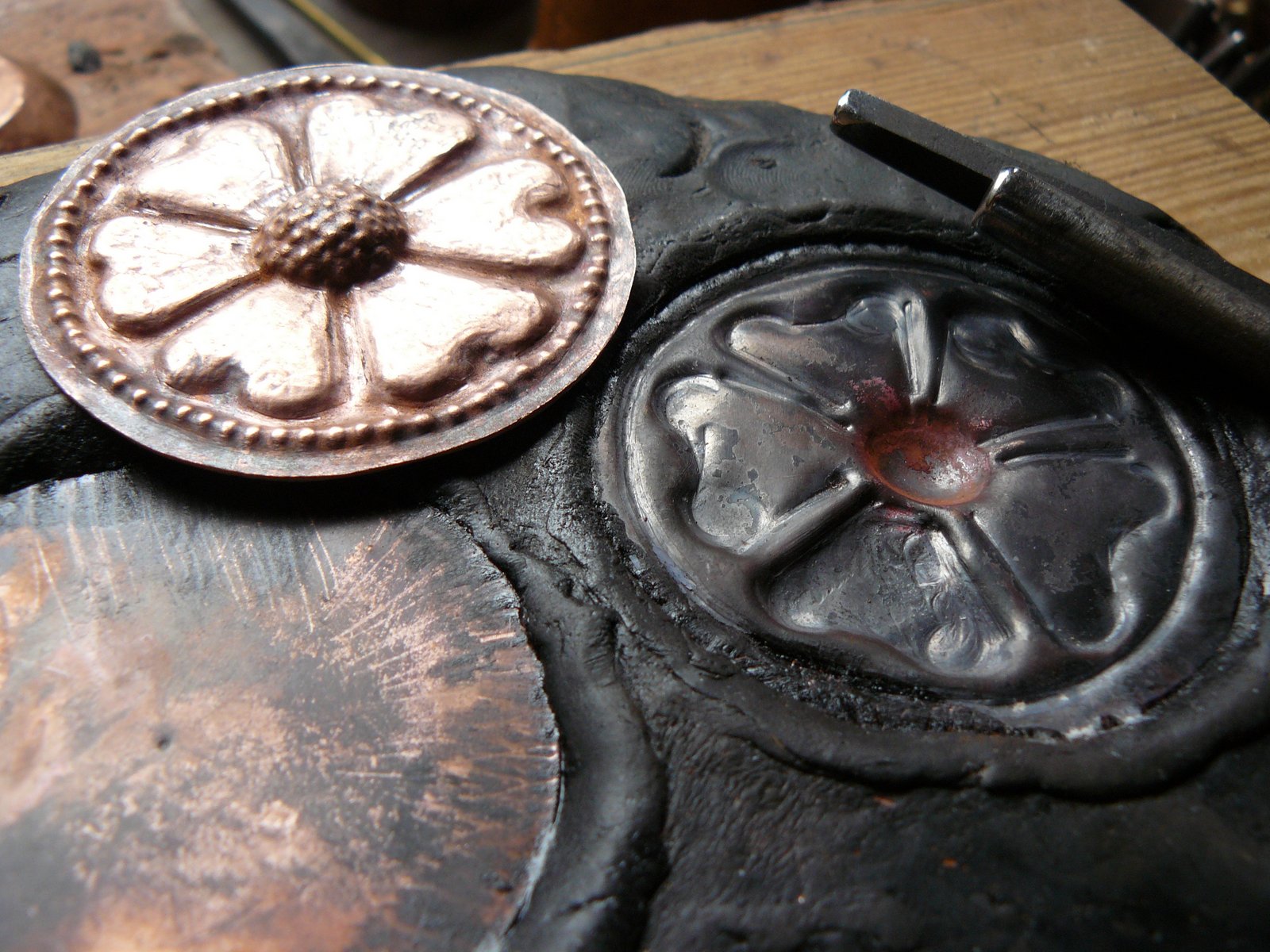 e l i g i u s: Repousse work and a mixture called tenax.