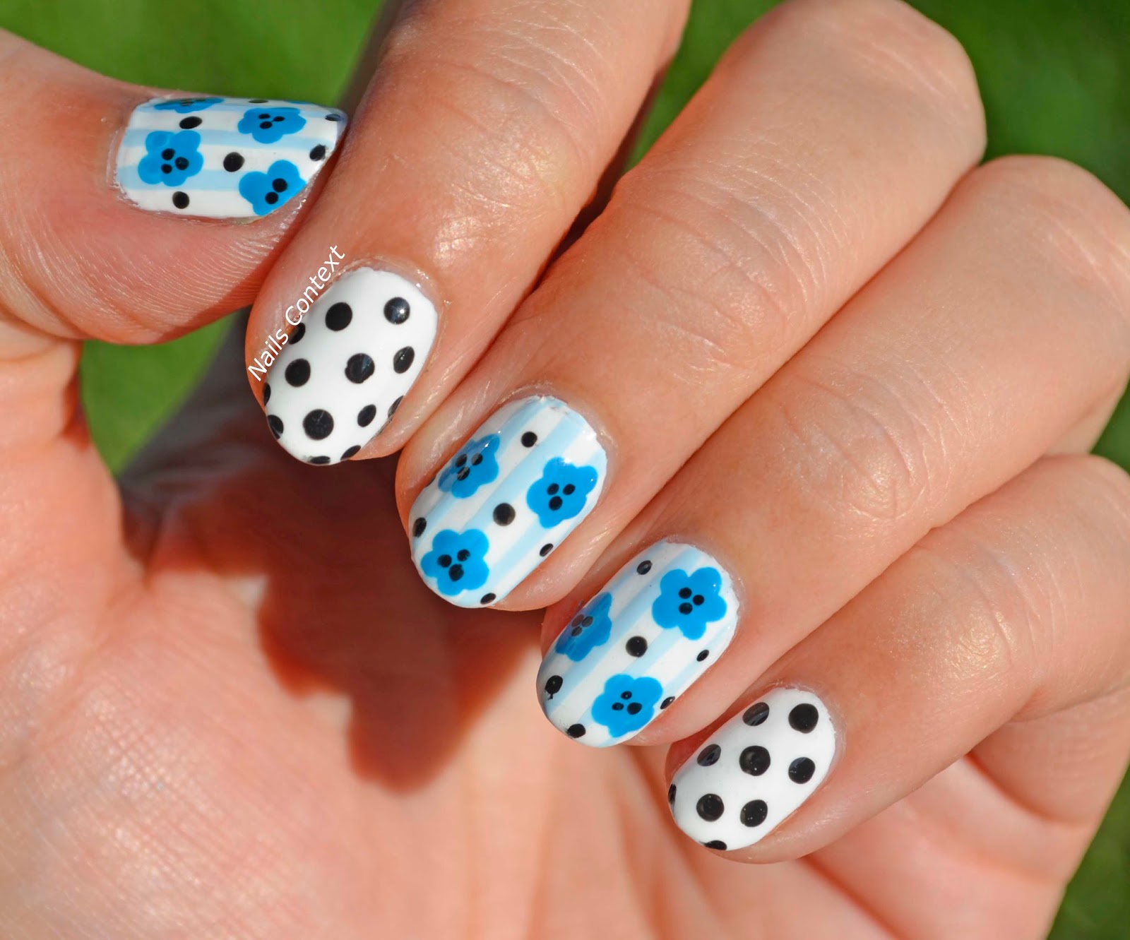 Nails Context: Blue spring flowers