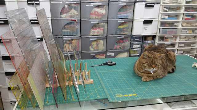 Feather On A Wire: Ruler storage.