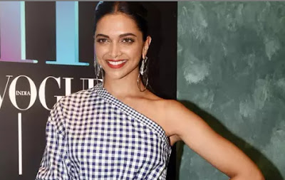 Actress Deepika Padukone wearing a bed sheet with a belt?