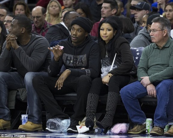 Nicki Minaj finds time for make-up touch up while at basketball game