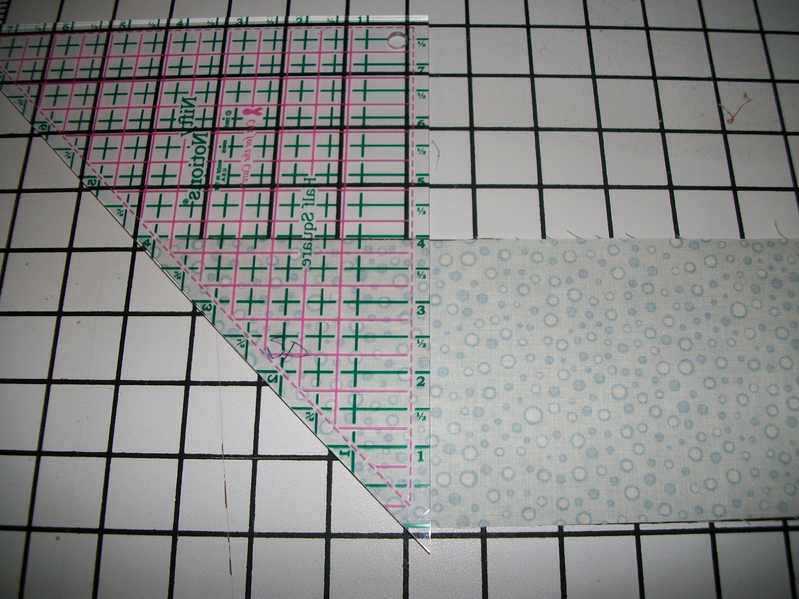 ambasadorr: Using a half square triangle ruler