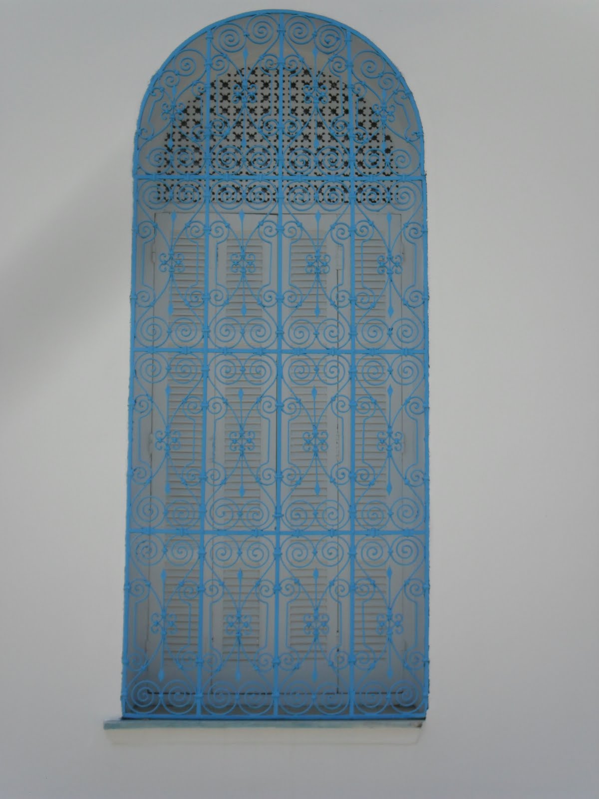 brightly coloured sunflowers: Wrought iron railings - fer forgé