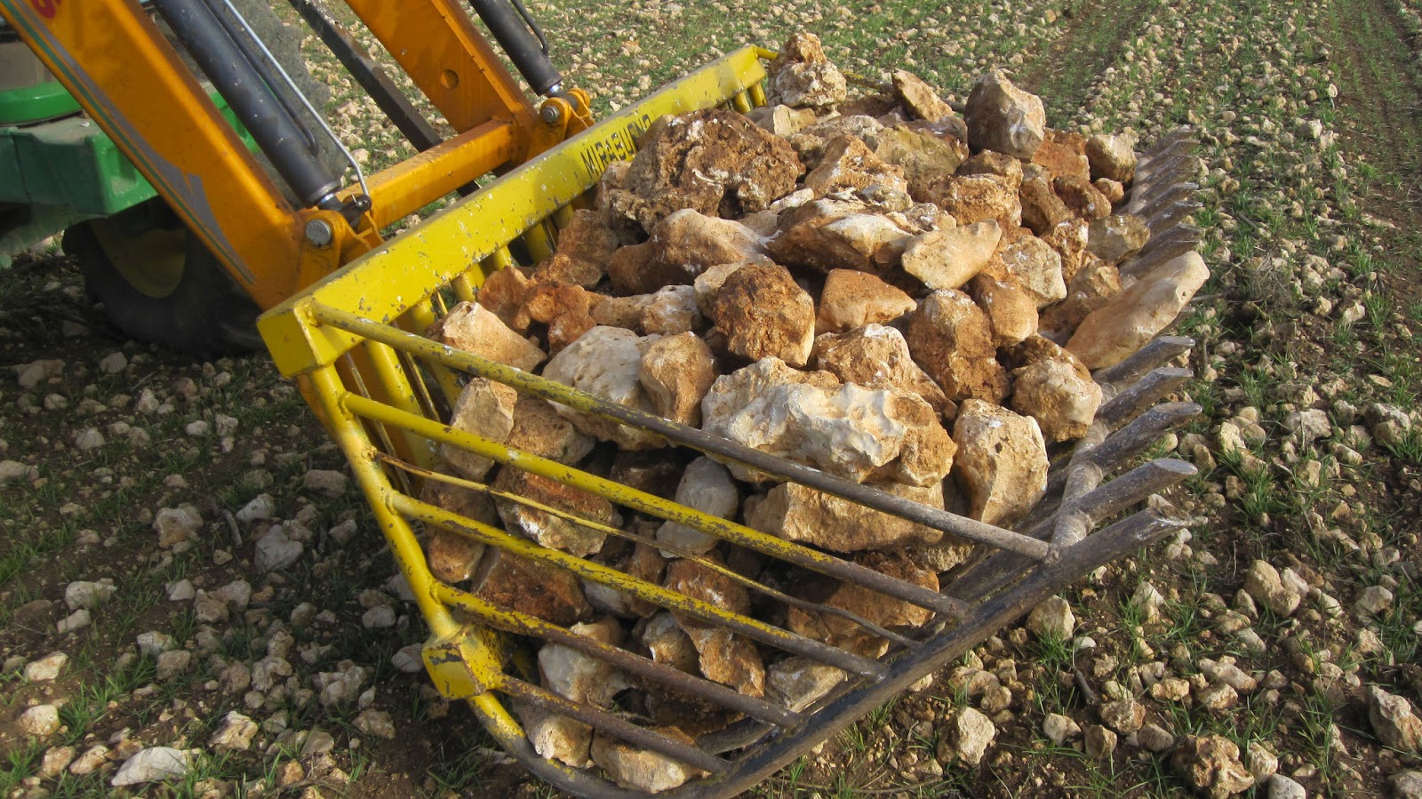 Hard job: Picking up stones “manually”