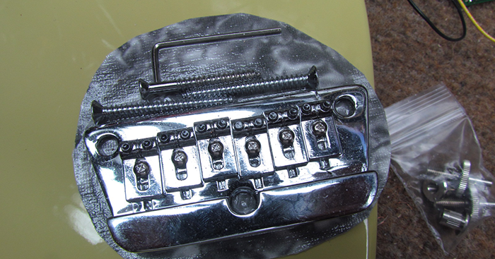 Fixing Sagging Danelectro Bridge Crawls Backward (When Alarmed)