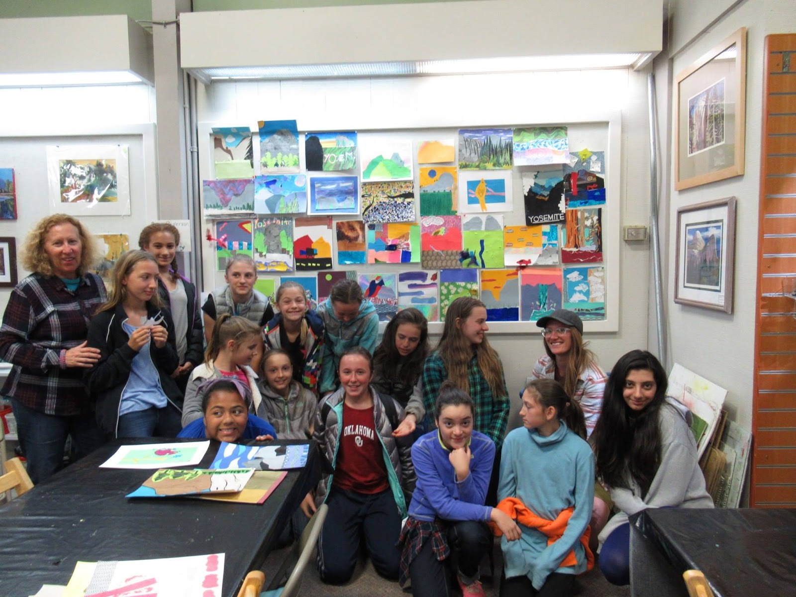 Happy Class showing off their collages- not one the same!