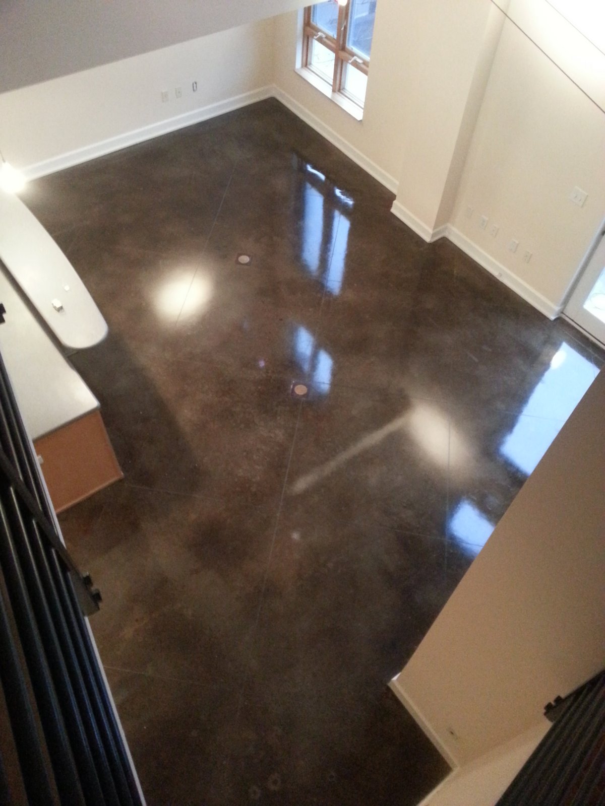 Epo- Floors: Waxed and buffed stained concrete