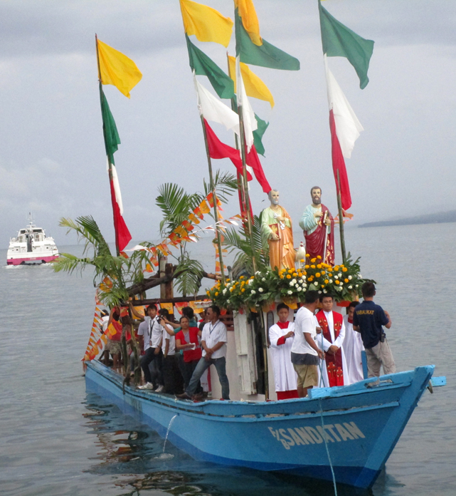 News: Fluvial, land procession successful despite rains