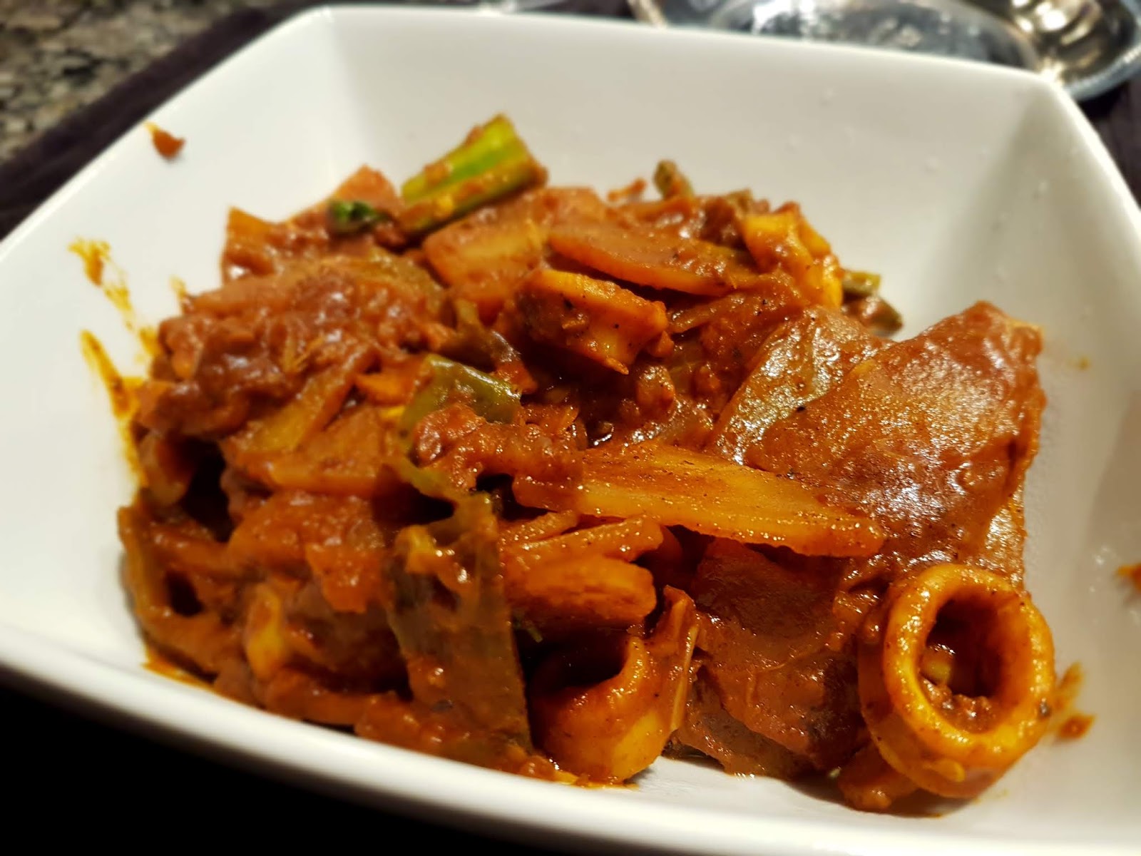 SQUID MASALA marinated squid sauteed with spices