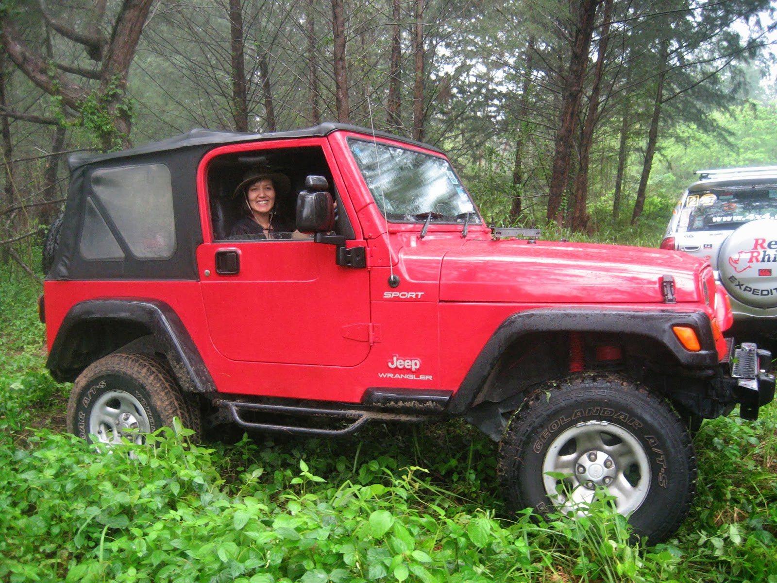 The Lady in the red Jeep Wrangler