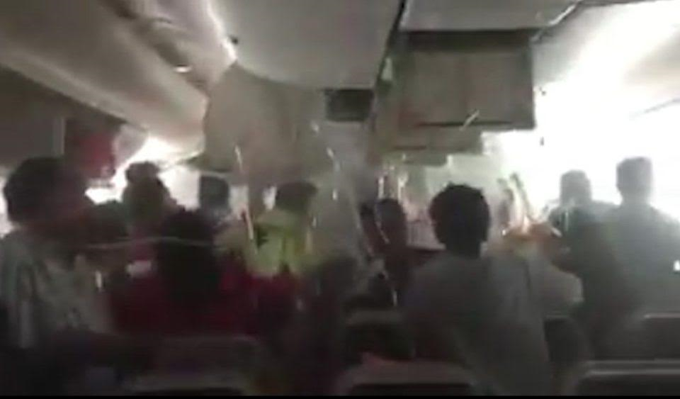 Watch the terrifying moment 300 passengers flee Emirates plane moments ...