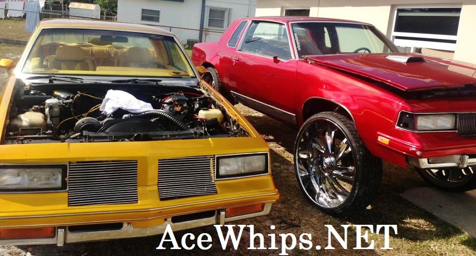 Ace-1: Candy Red Oldsmobile Cutlass on Brushed 32" Girato Forgiatos