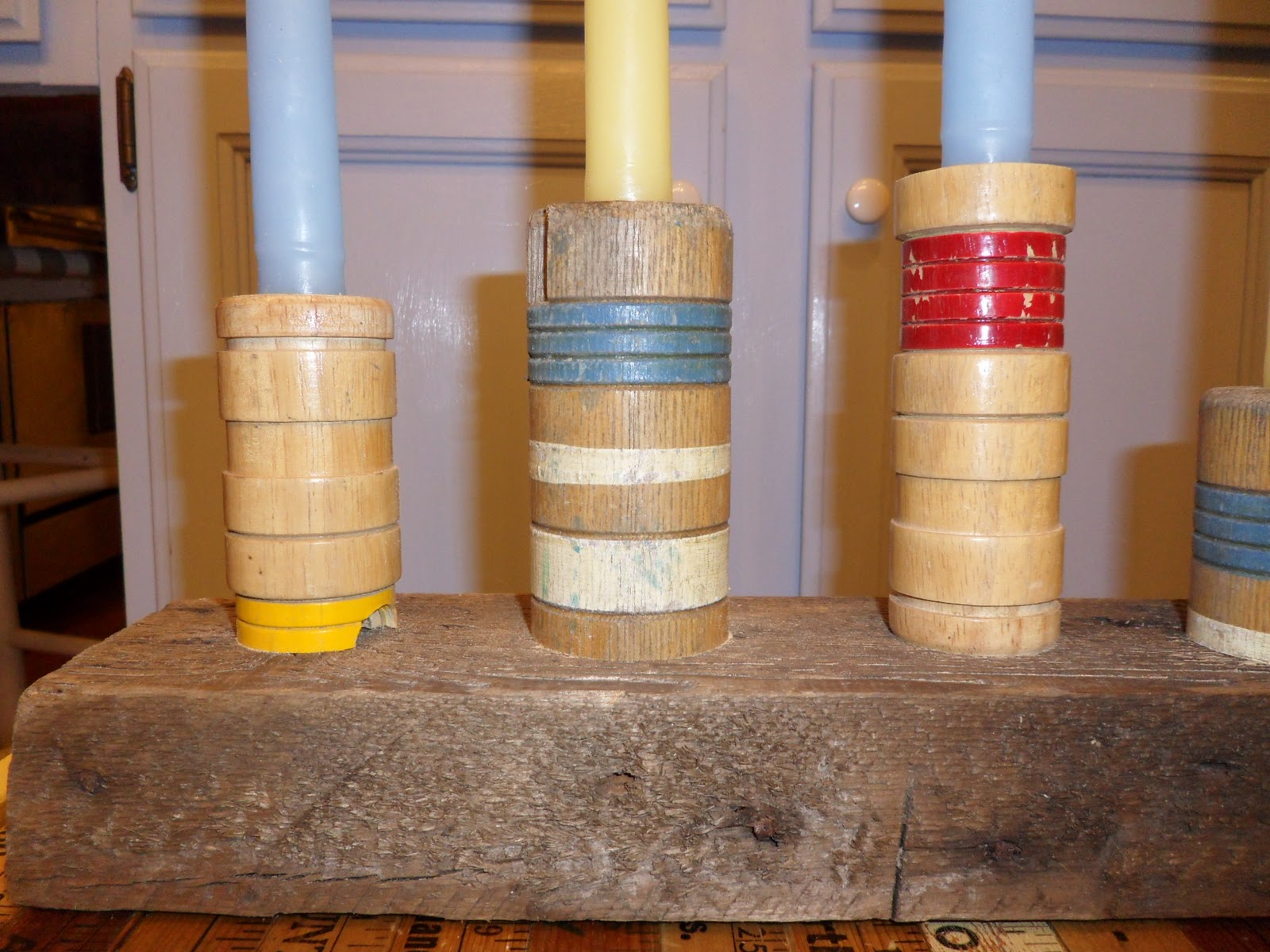 reclaimed crafts: croquet mallet heads repurposed as candlesticks