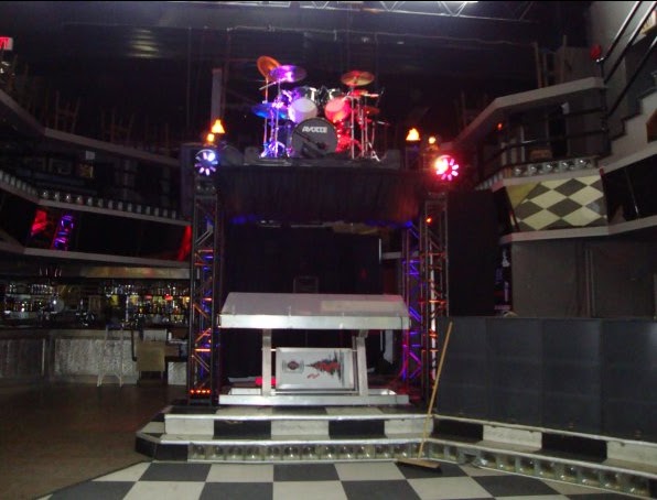 The Stage Spot: Drum riser on Truss above DJ in Club
