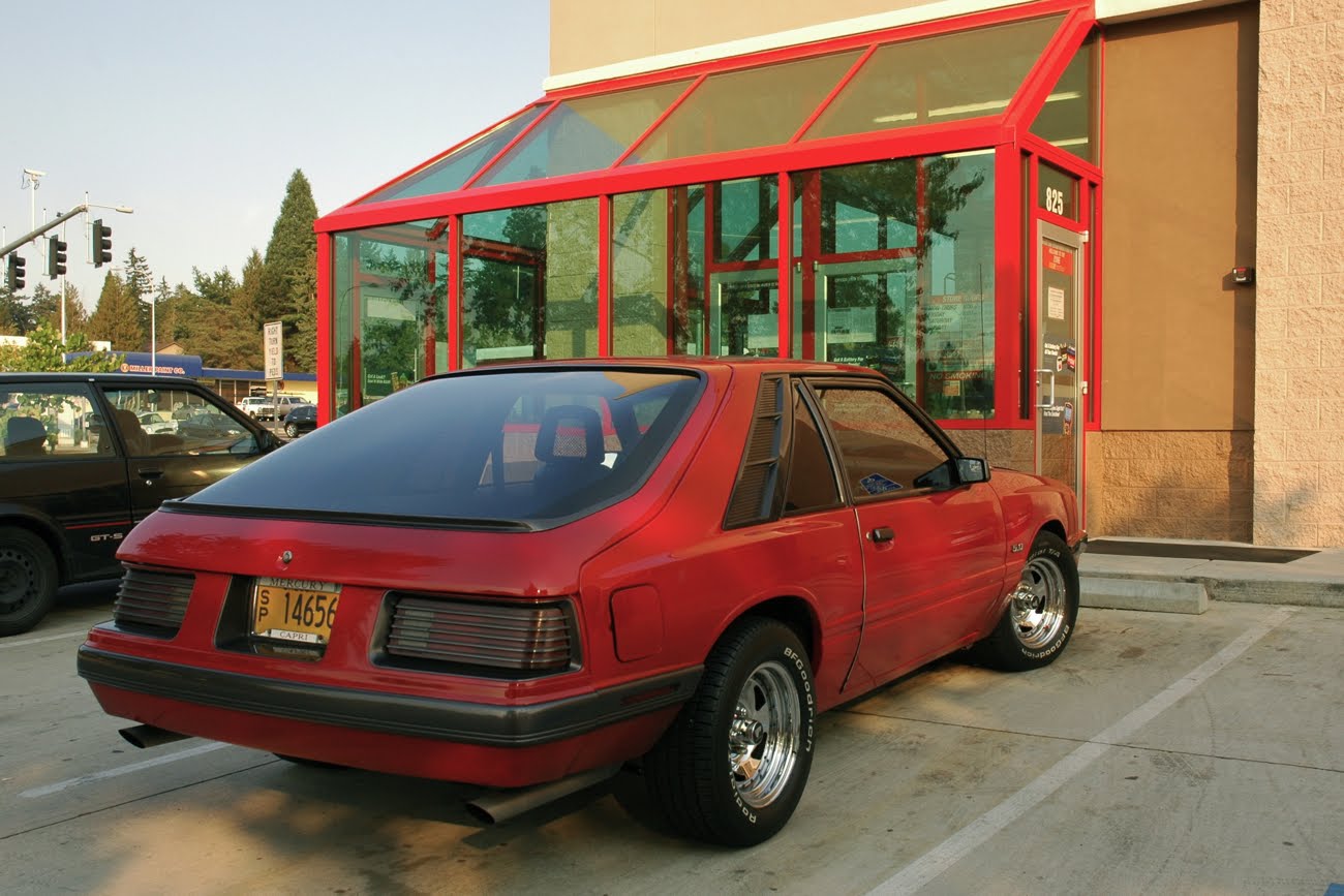 OLD PARKED CARS.: 1985 Mercury Capri.