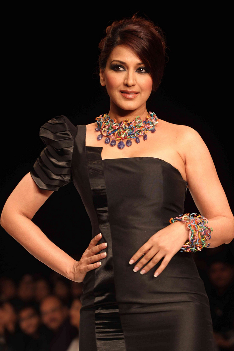 Sonali Bendre In One Shoulder Black Long Dress Walking On Ramp At Fashion Show Raga Cinema