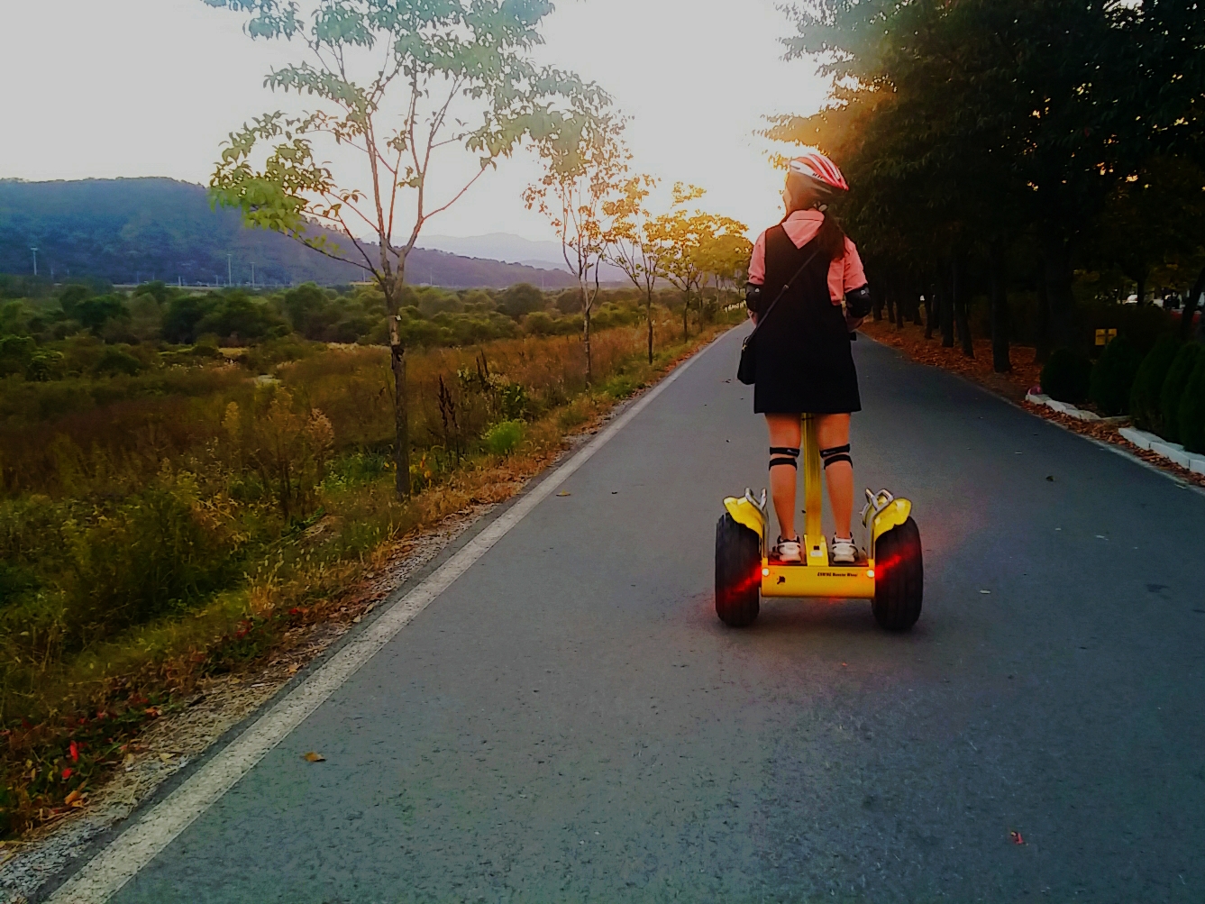 Leisure Activity For Weekends - 2 Wheel Electric Scooter Riding along ...