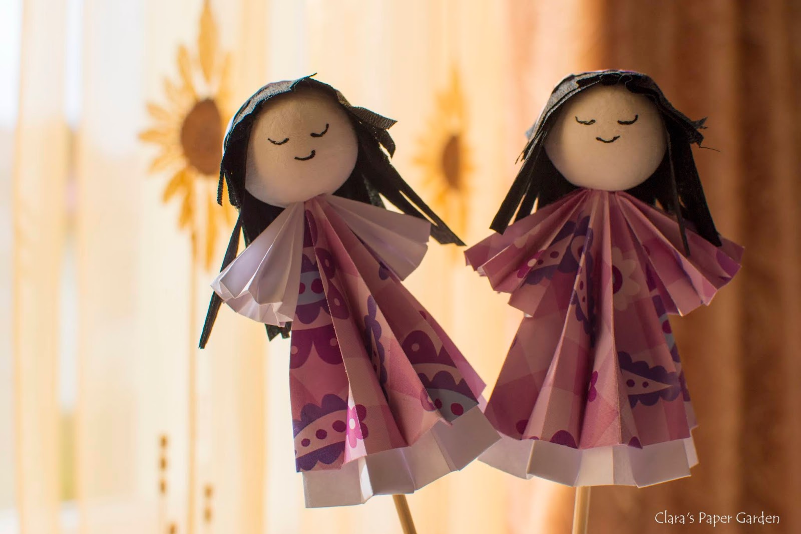 Purple and orange paper dolls