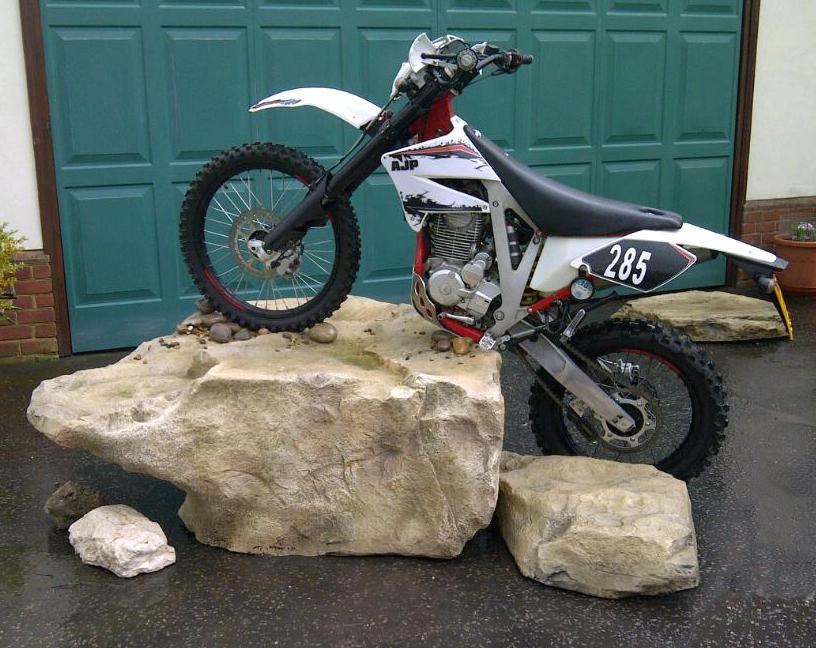 All about plants and planters: Real bike, fake rocks.