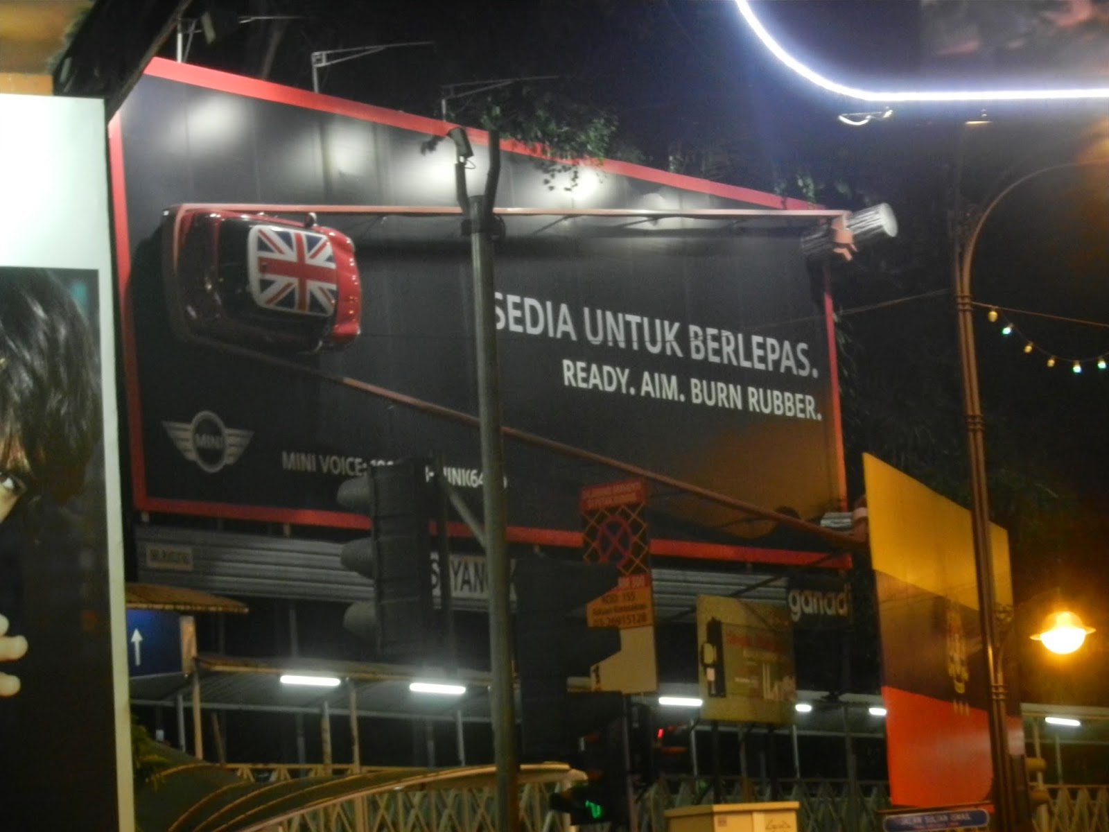 Once around the big blue marble: Mini Cooper Suspended on a Billboard