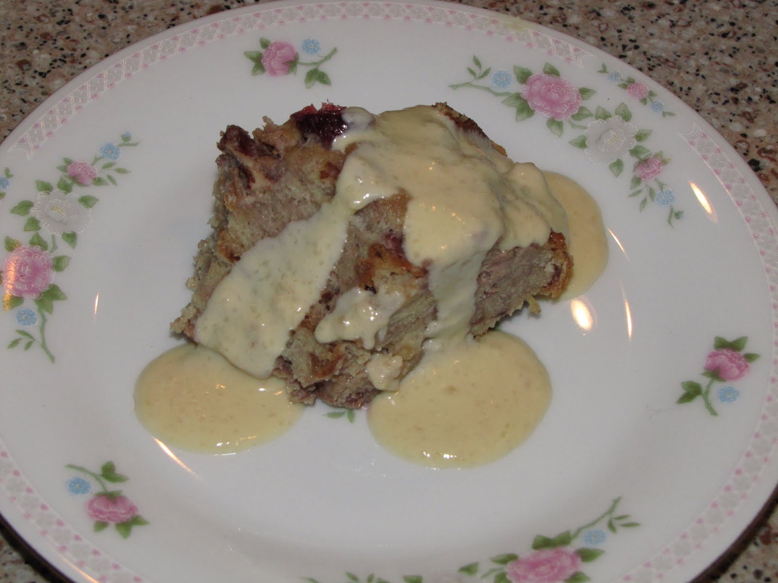 Family American Style: Bread pudding with vanilla custard sauce.