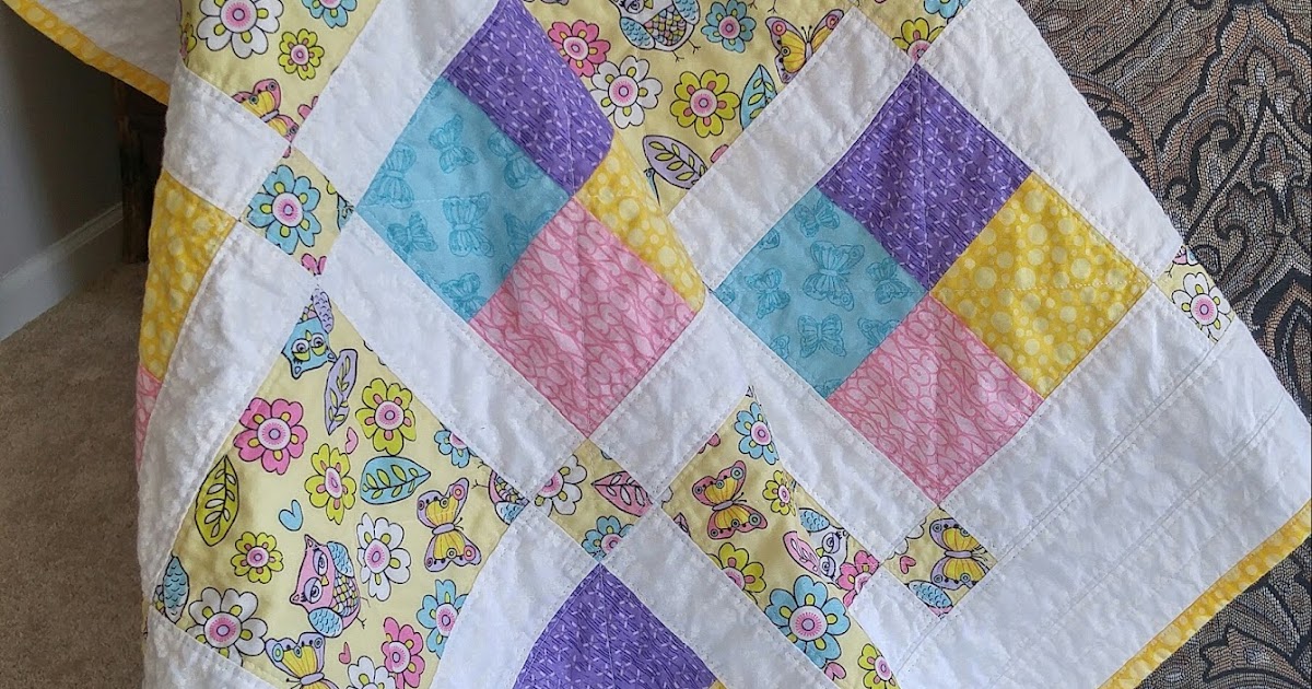 ...by CJ: Bright baby quilt finish