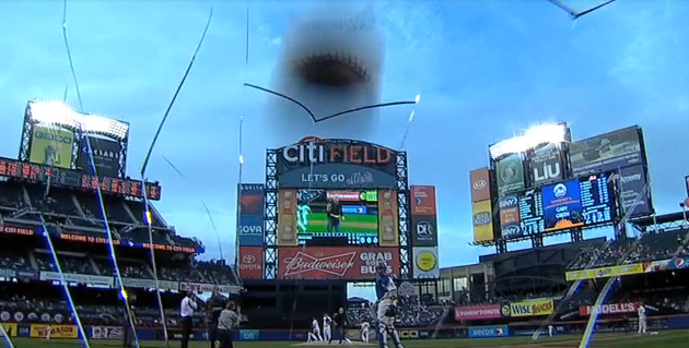 Ceremonial first pitch at Mets game breaks glass behind home plate ...