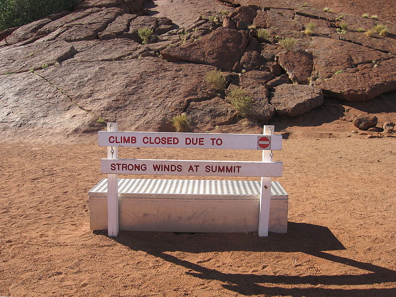 Pictorial history of warning signs at the base of the climb at Ayers Rock