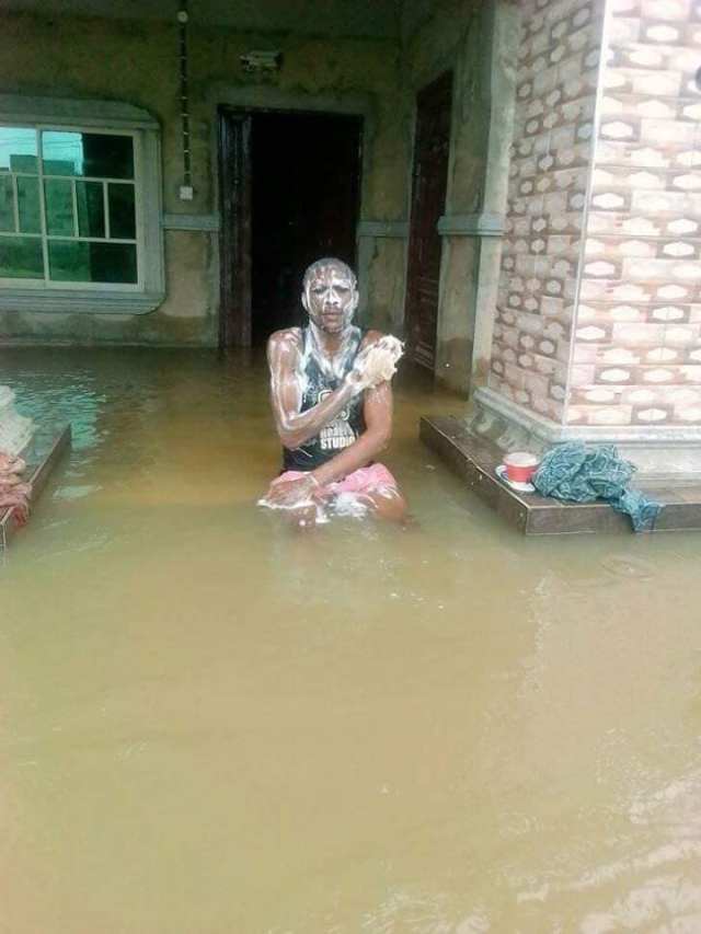 Funny Pics Of Man Bathing Inside Flood That Covered His Home - Mr ...