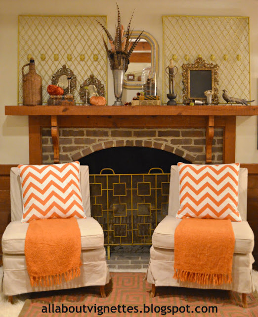 I adore the paper bag flowers that flow down the wall in this mantel by ...