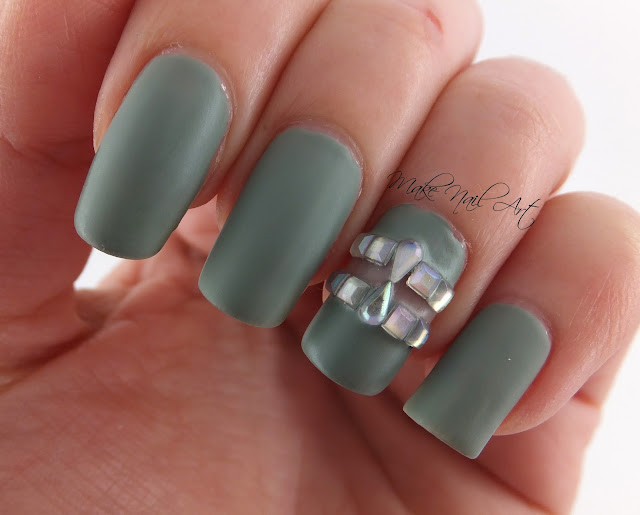 Matte Green Cut Out And Rhinestones Nail Art Design