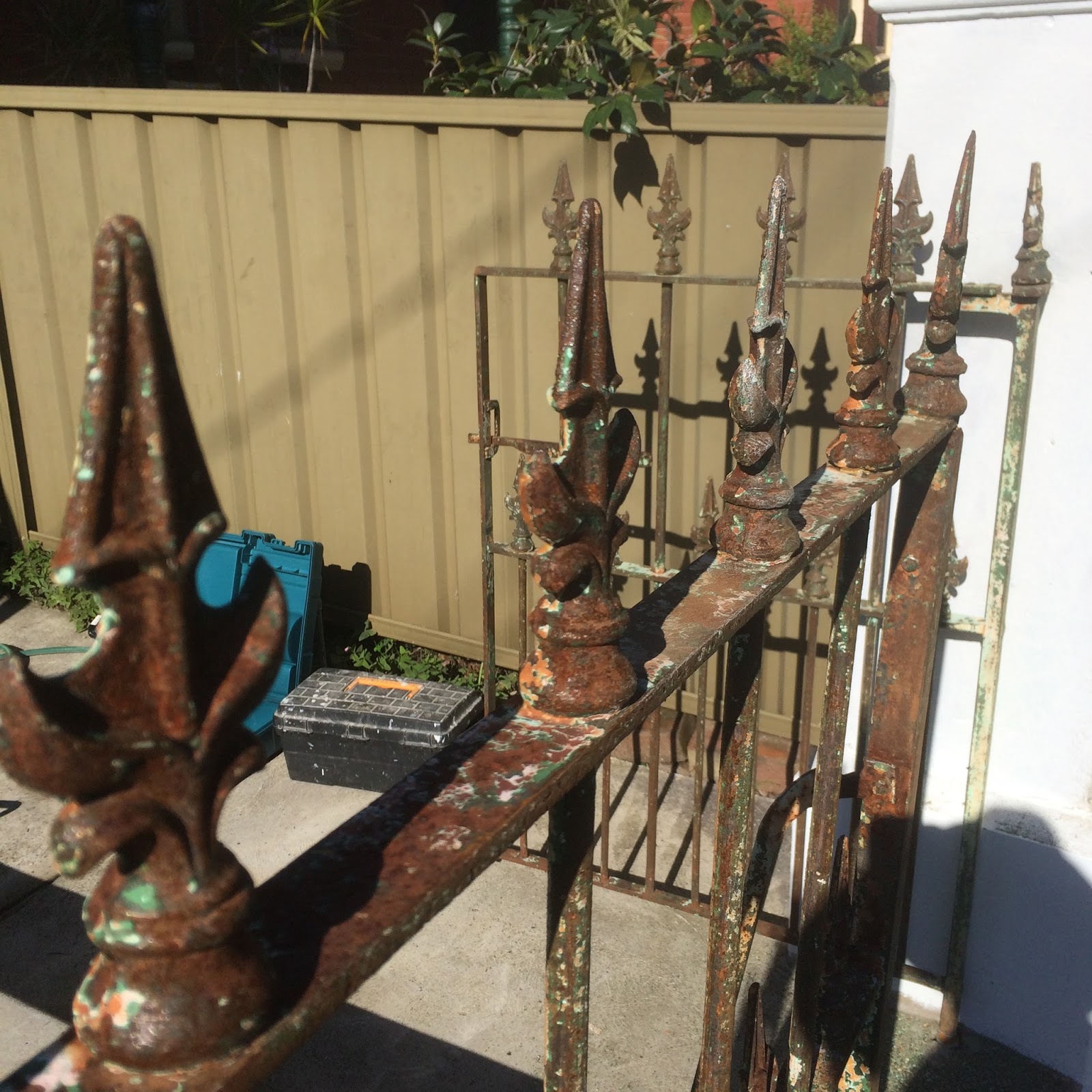 Exterior - Repainting rusted iron fence..