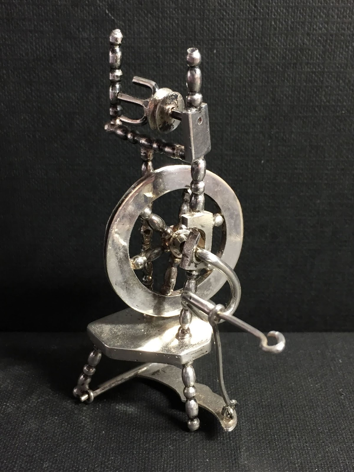 Silver spinning wheel