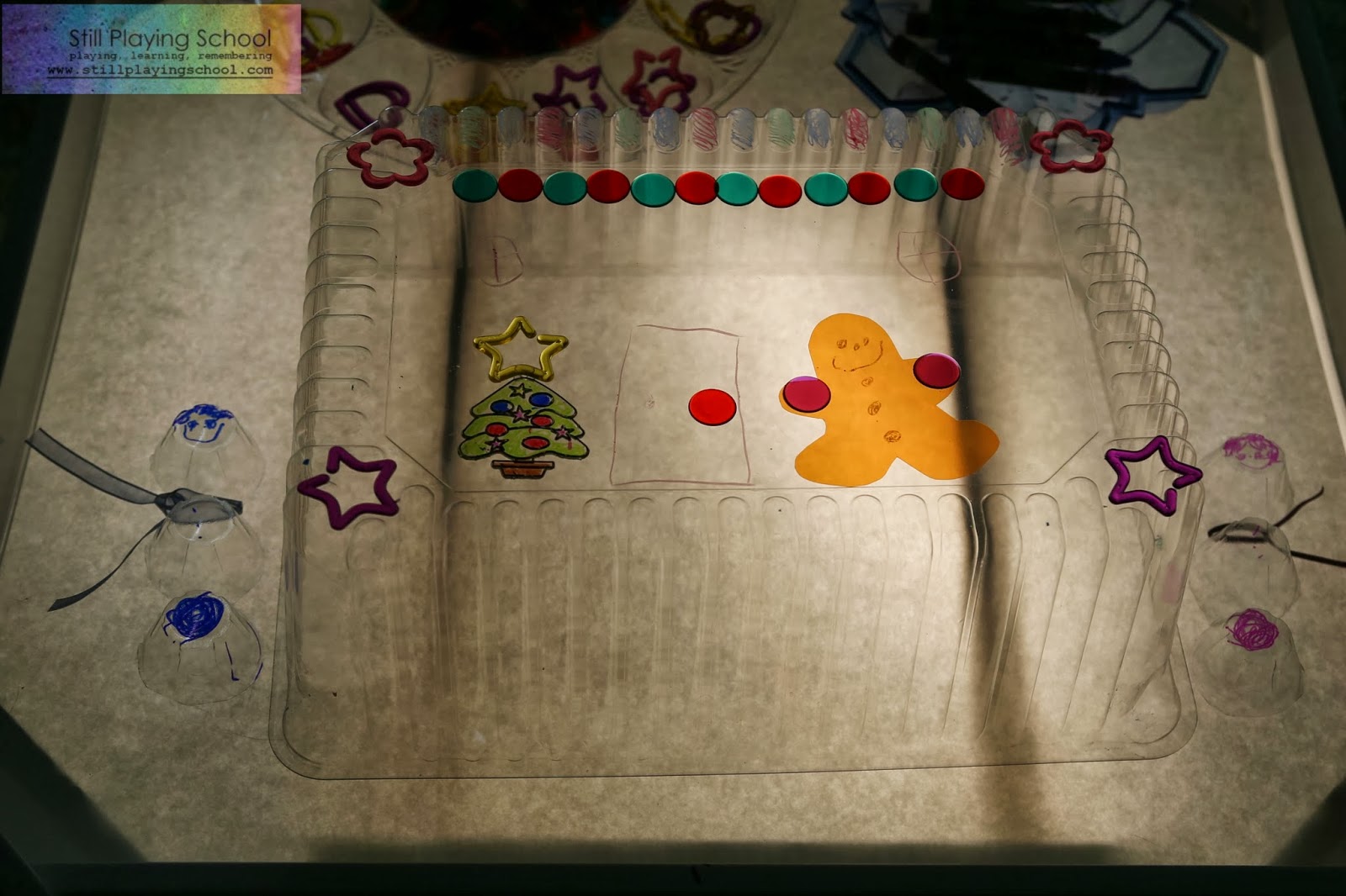 Gingerbread House on the Light Table | Still Playing School