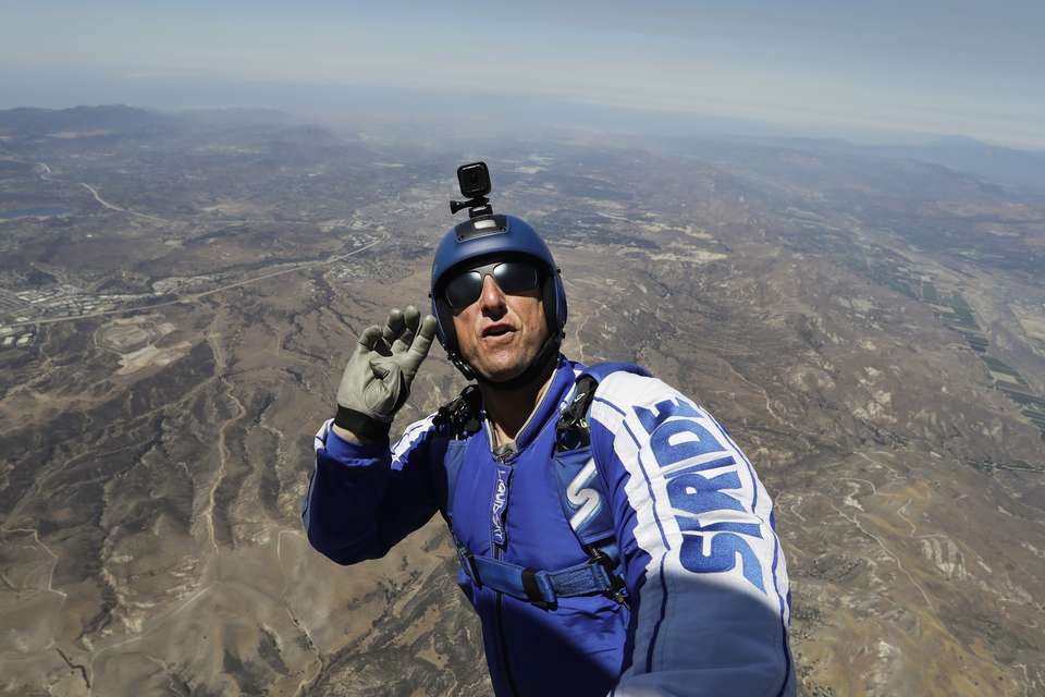 Skydiver becomes first person to intentionally jump and land without ...