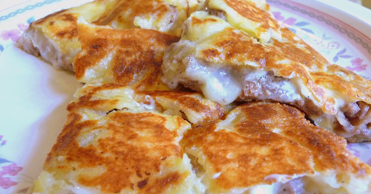 MOLTEN CHEESE BEEF OR CHICKEN QUESADILLAS