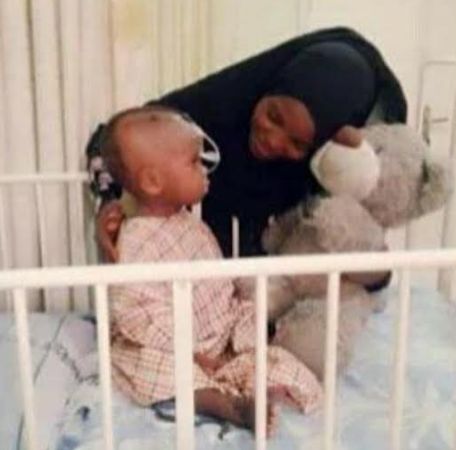 Photo: Baby Musa gets a cute teddy bear from Mrs Toyin Saraki