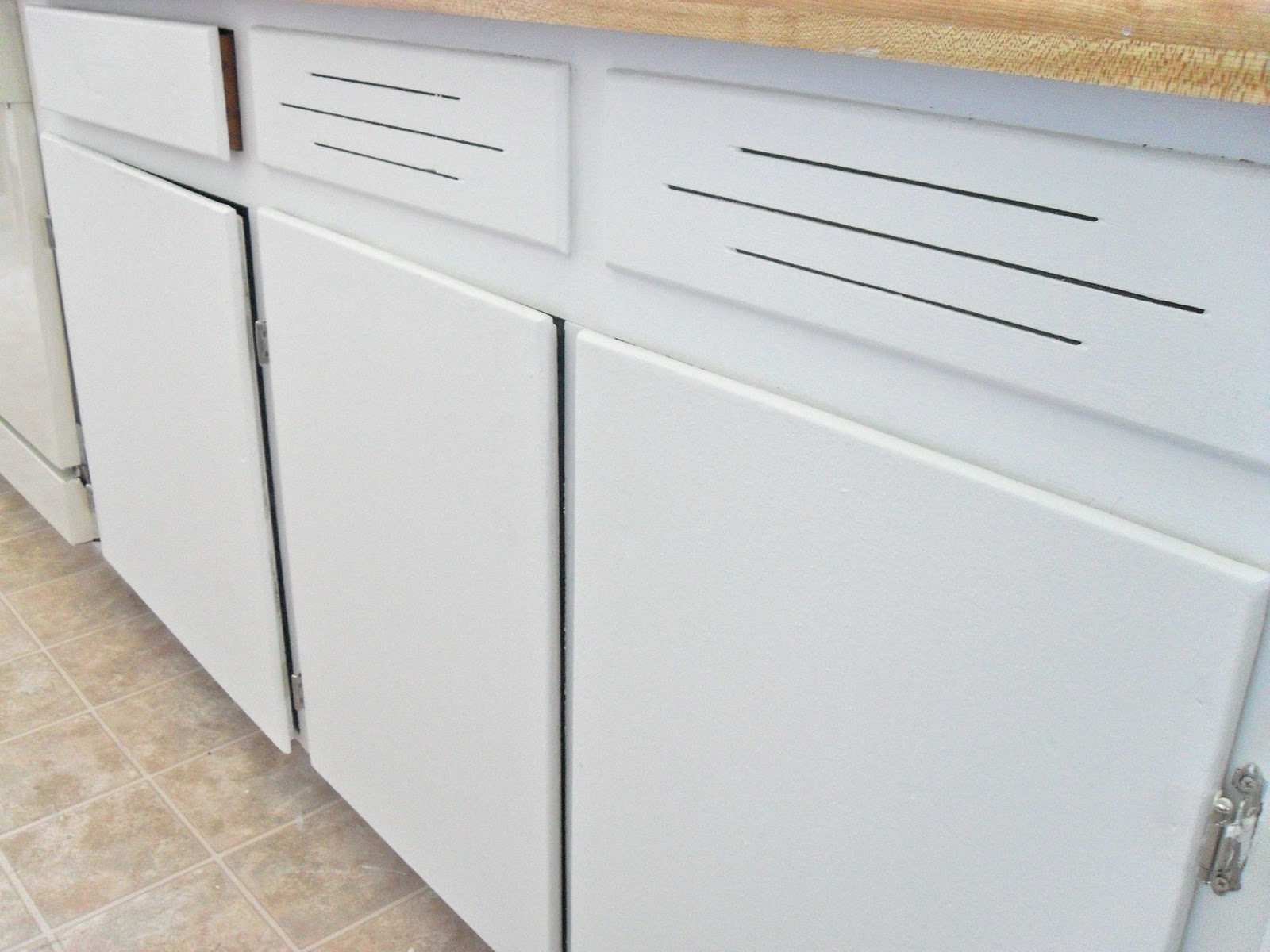 The Remodeled Life: DIY - Painting Knotty Pine Cabinets