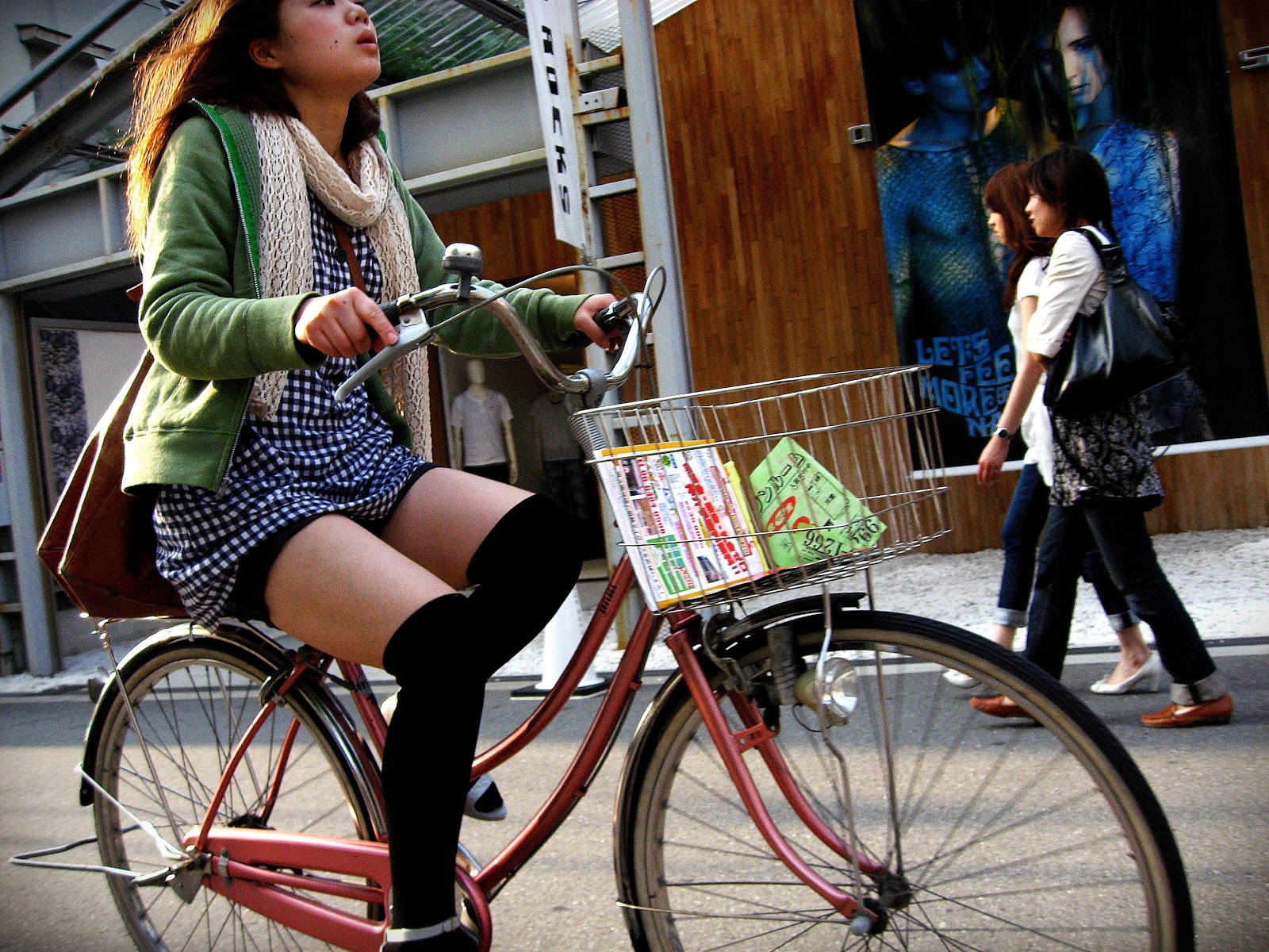 Cute Girl Riding Bike In Osaka